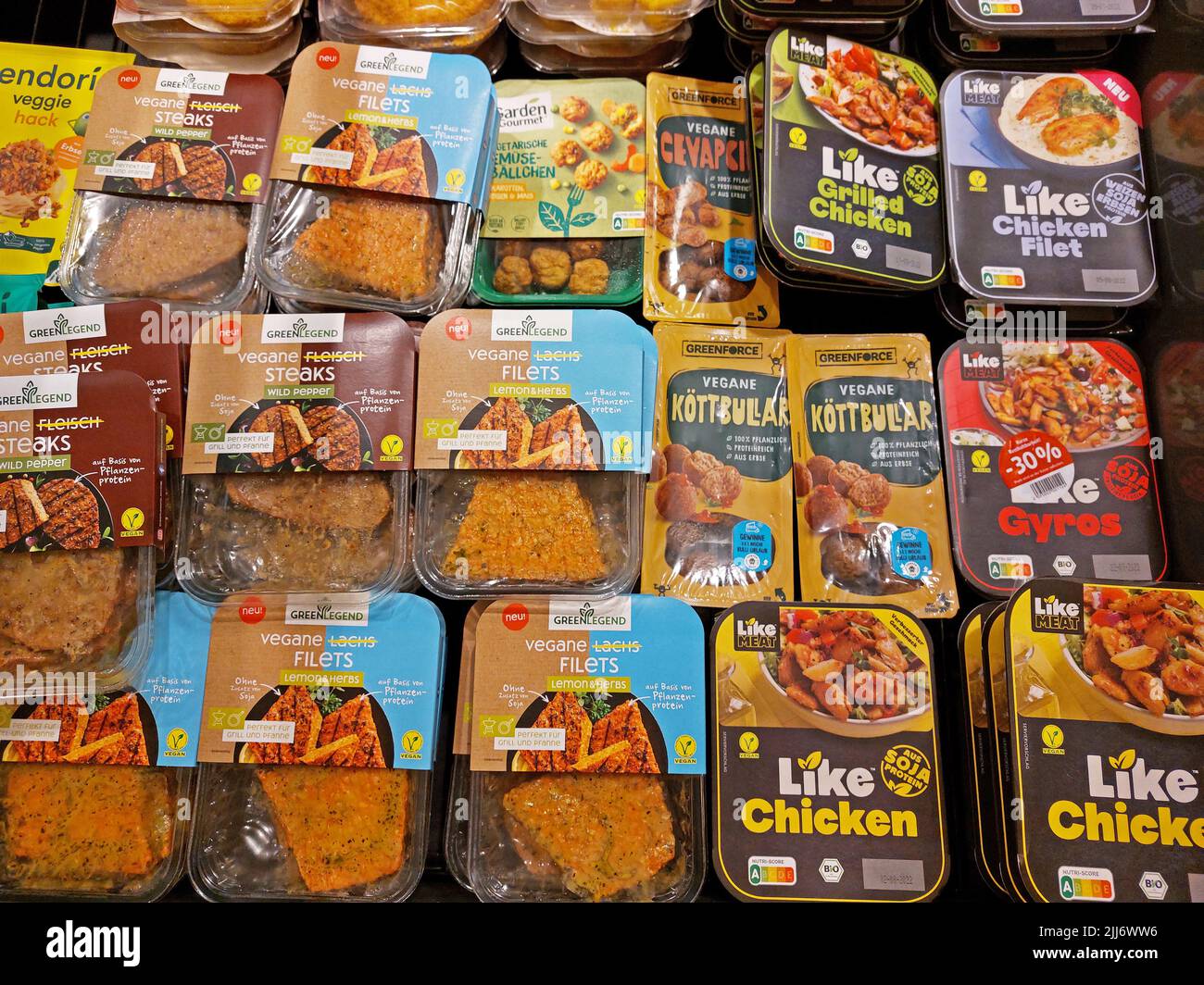 selection of vegan food packages made by different brands in a ...