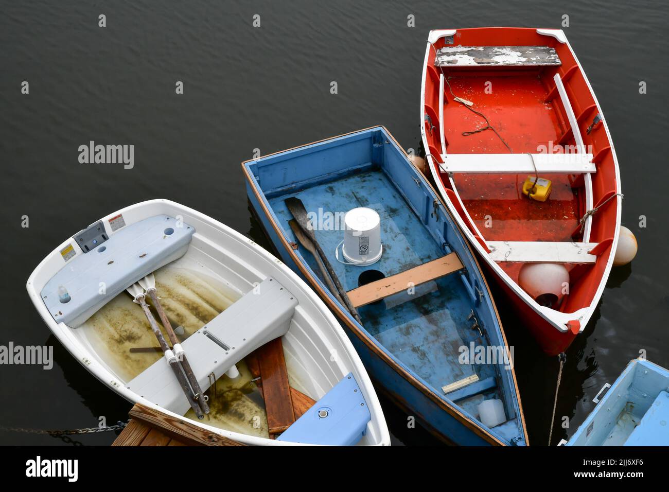 Colorful wooden fishing boats tied to the pier Stock Photo - Alamy