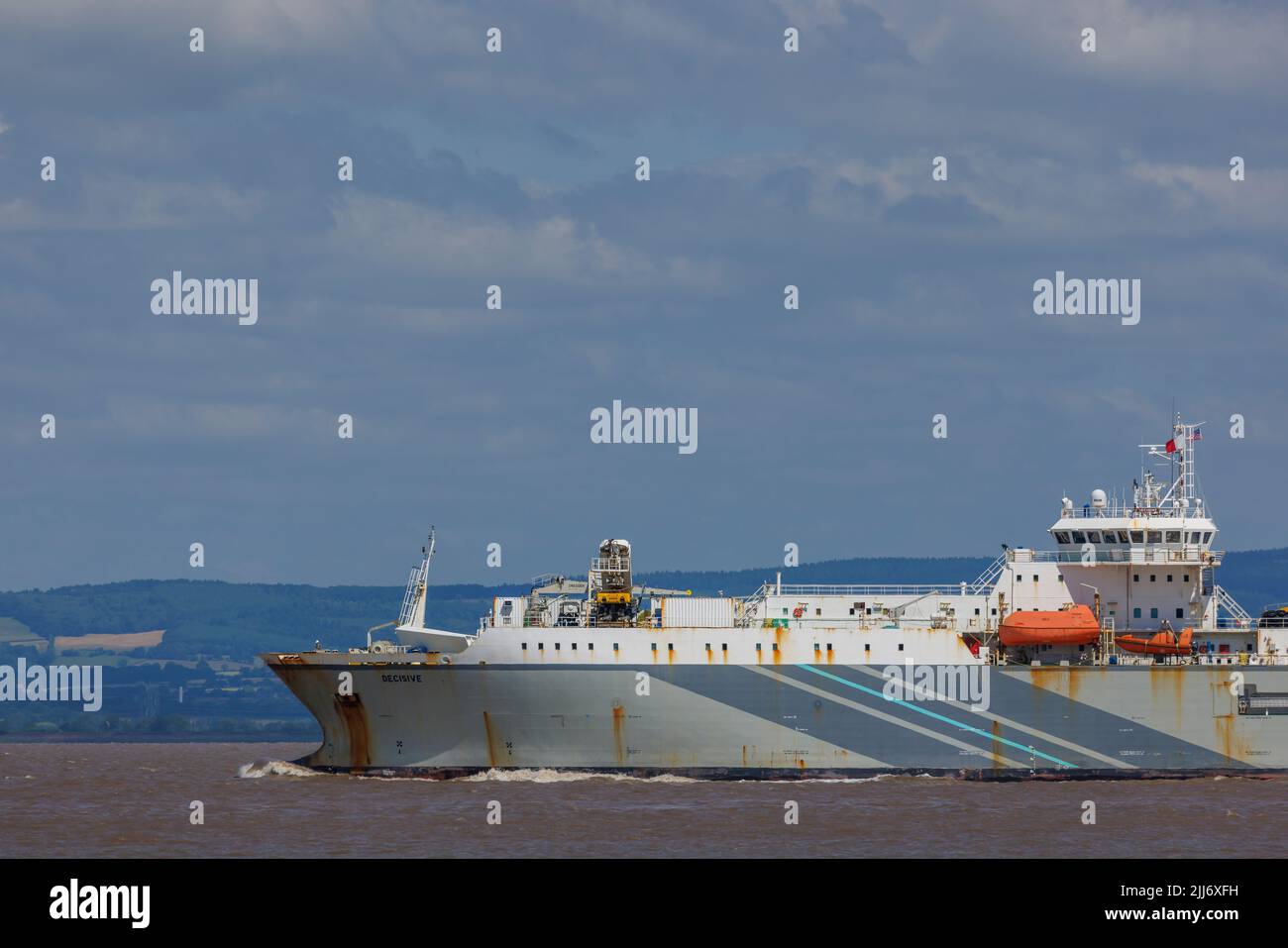 Cable layer Decisive heading out to sea Stock Photo - Alamy