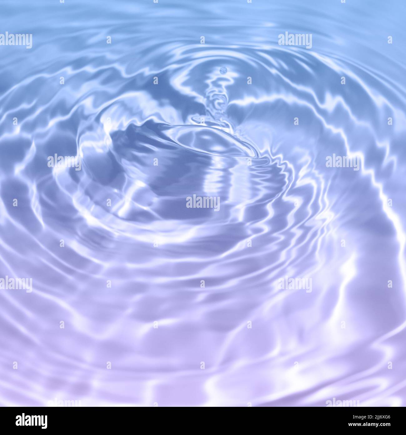 Serum or water texture close up. Bright blue and pink gradient liquid ...