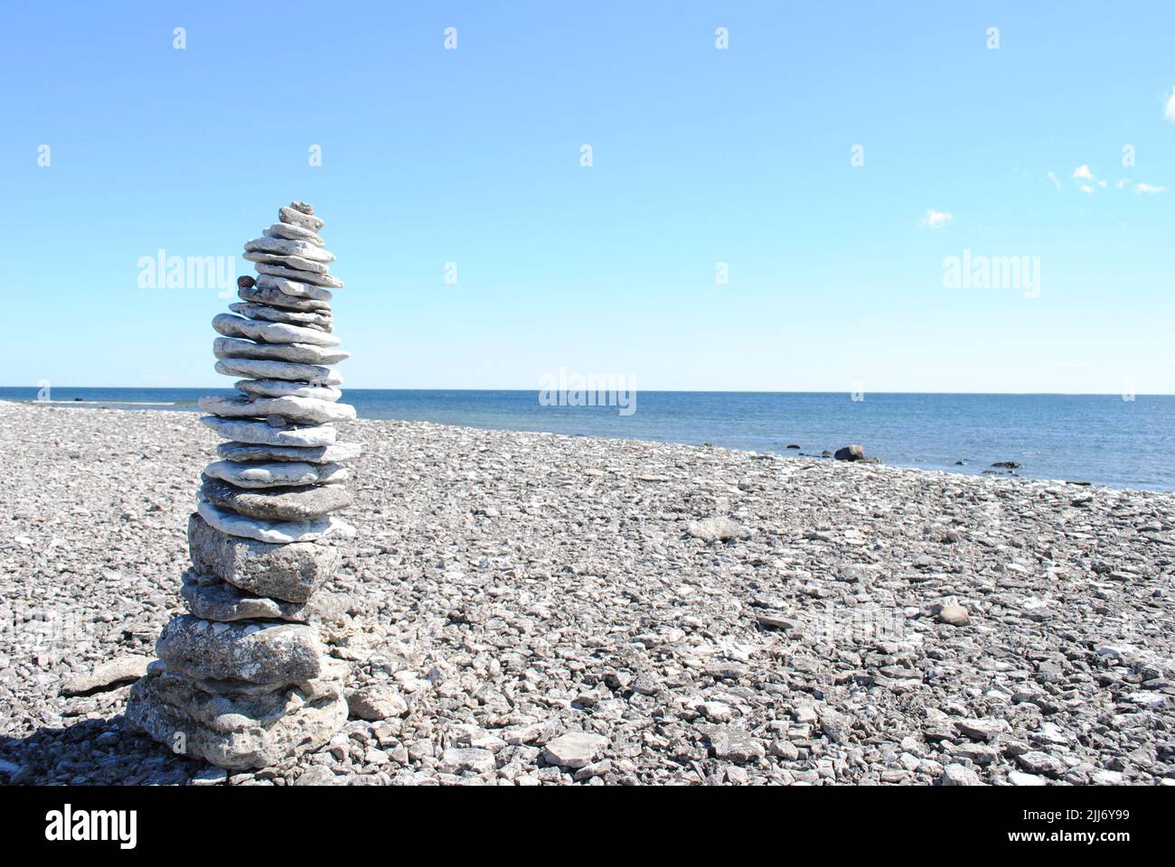 A stack of pebbles on the beach with the concept of zen and peace Stock ...