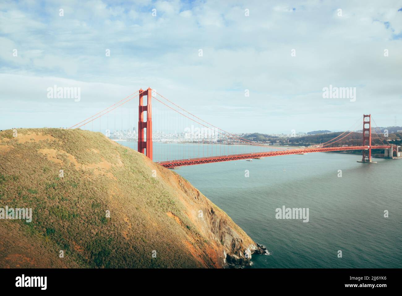 A beautiful side view of the Golden Gate Bridge under cloudy sky Stock ...
