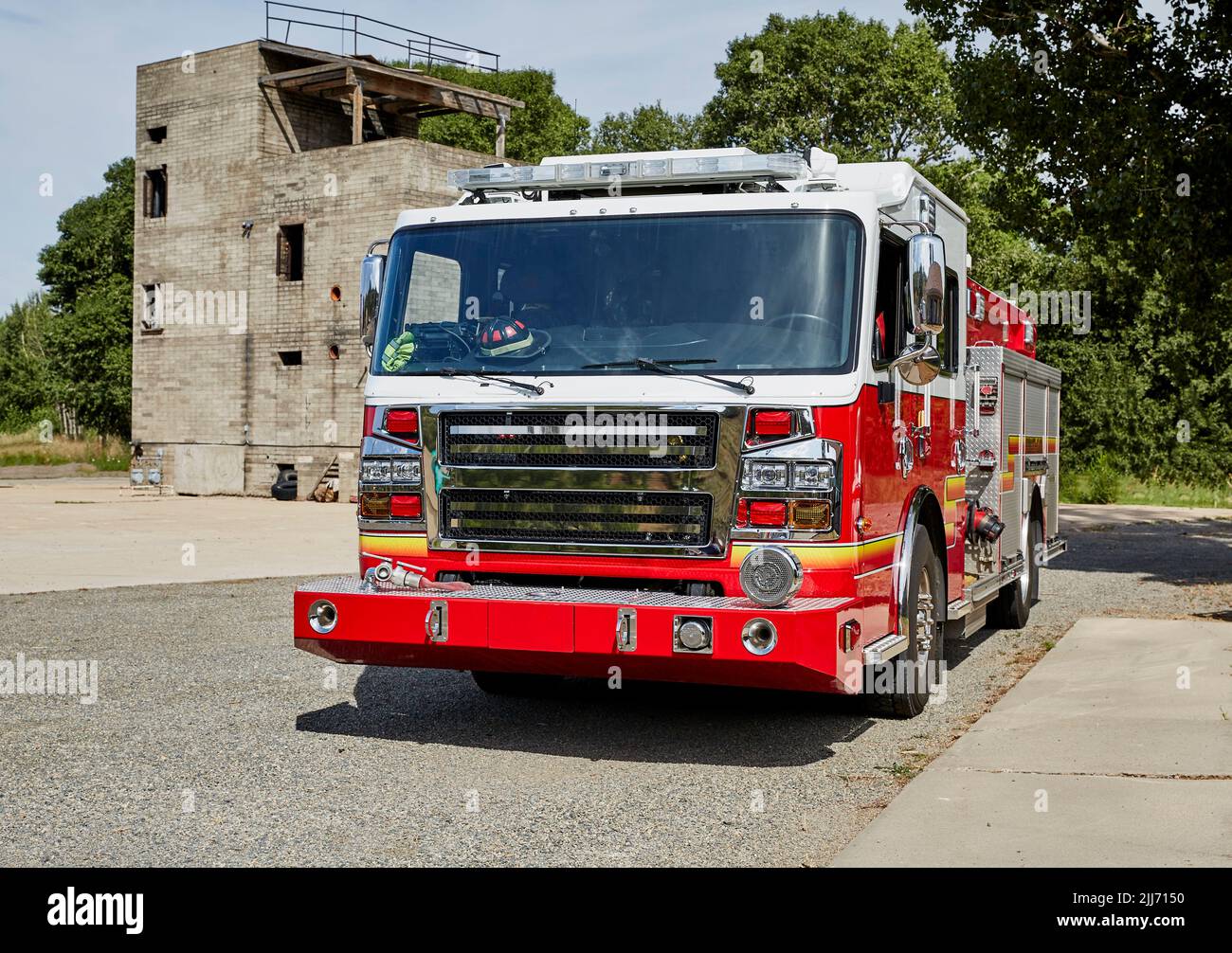 Fire Truck parked by a fire training building Stock Photo - Alamy