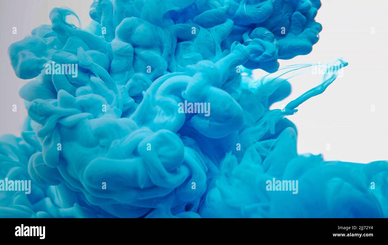 An ink drop in water isolated on white background Stock Photo - Alamy