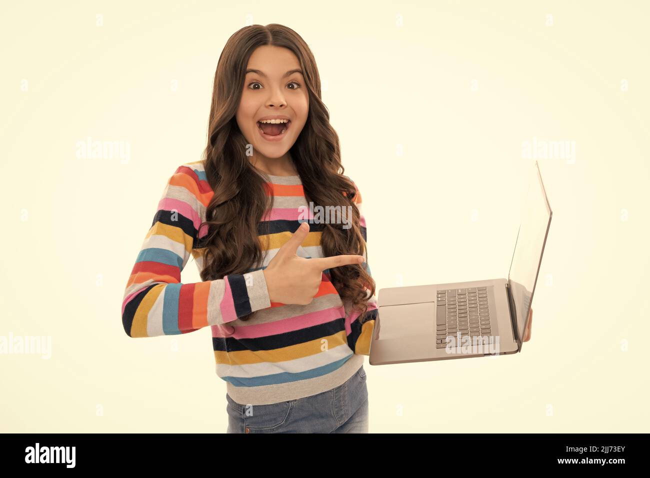 surprised teen girl study online education pointing finger on computer ...