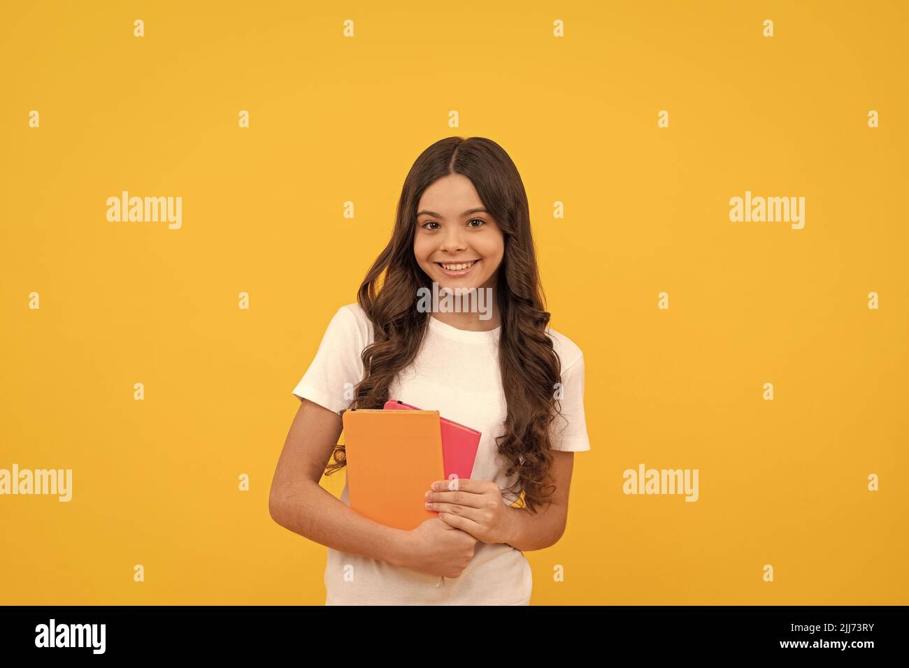 Cheerful teen girl workbook hi-res stock photography and images - Alamy