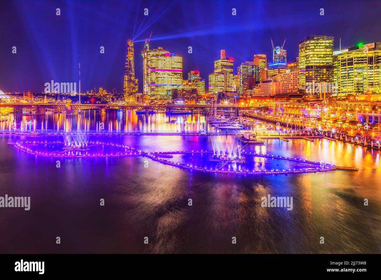 Floating colour fountain on Cockle bay in Sydney city CBD waterfront at ...