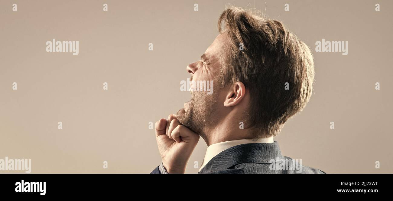 Professional man employee got punch in face with fist grey background ...