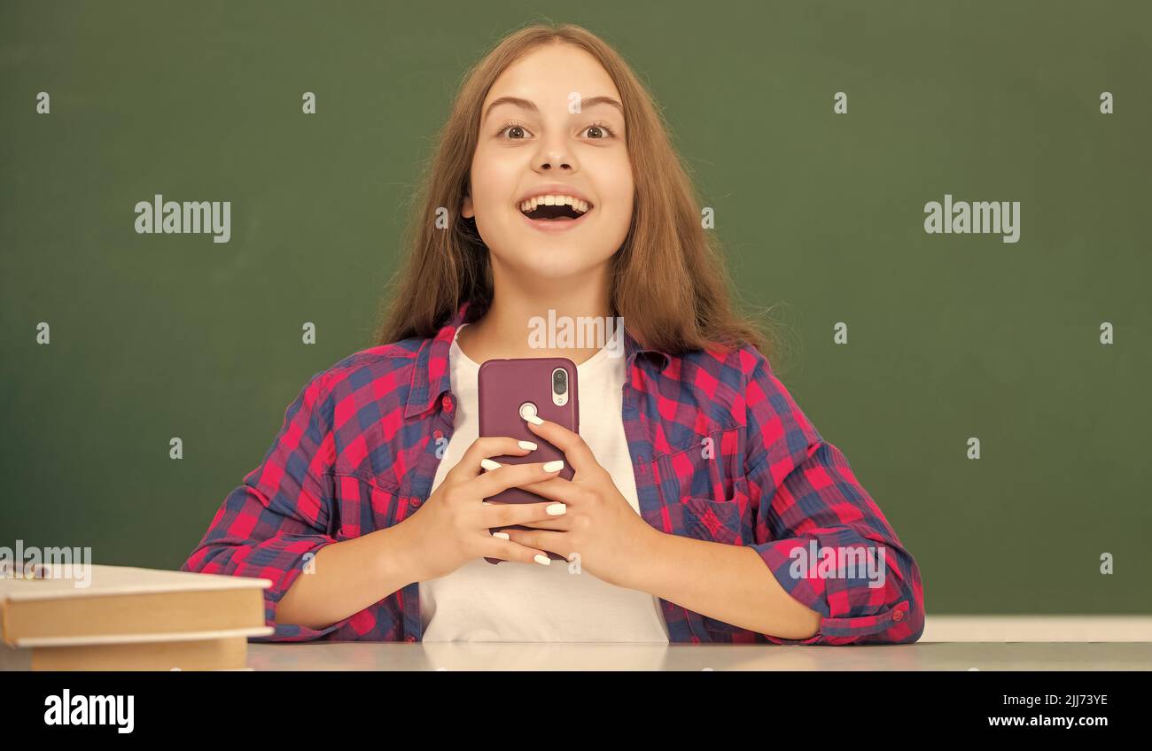 happy kid chat online in classroom. september 1. child typing and ...