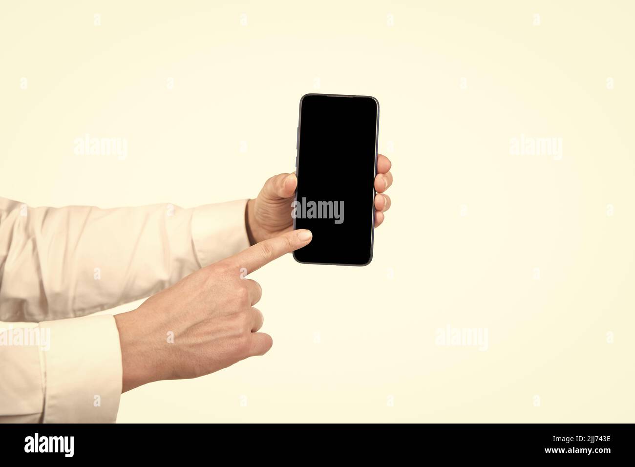 phone presentation in hand pointing finger on screen copy space ...