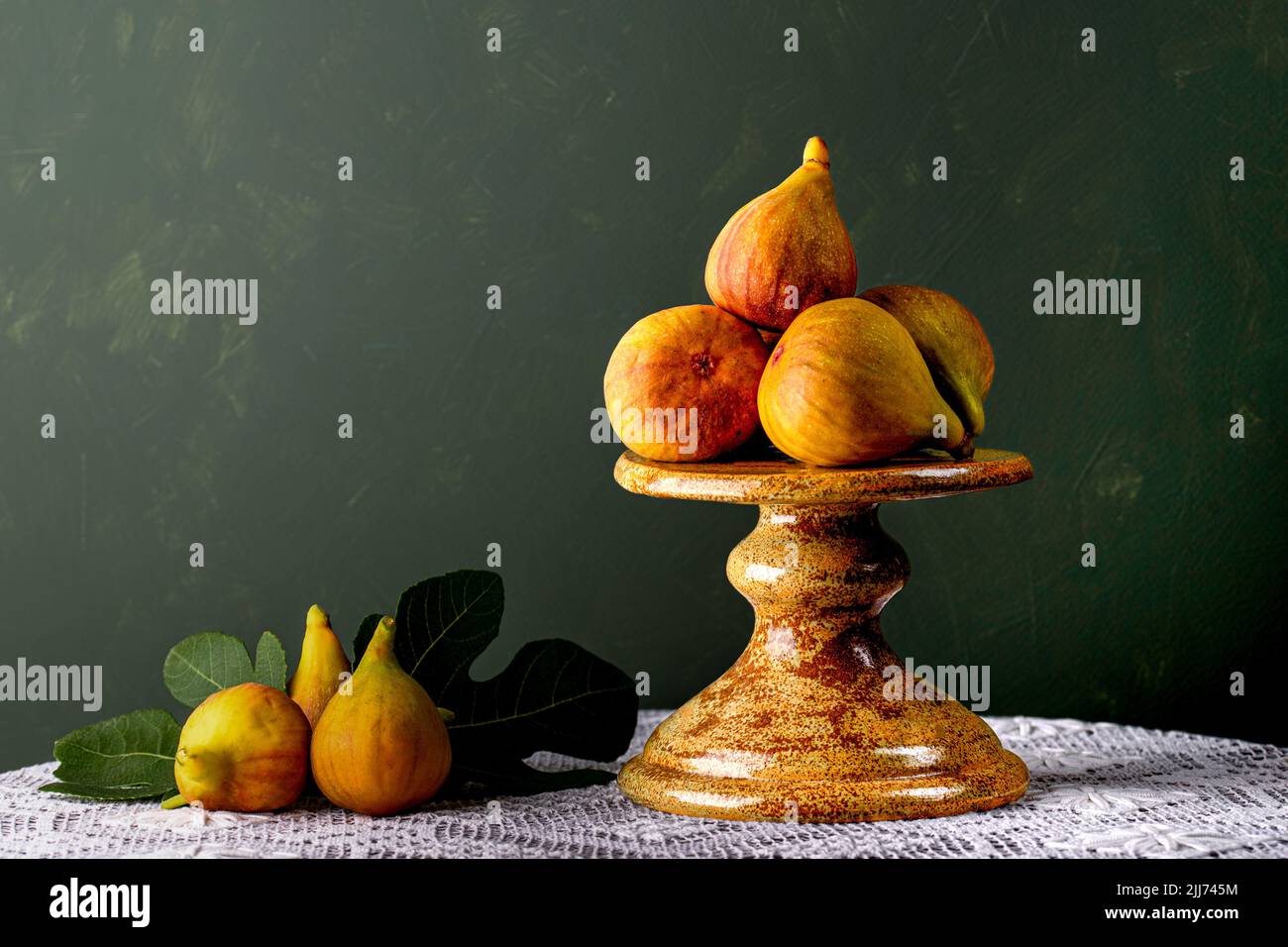 Group of fresh, organic yellow figs, against wooden background, with ...