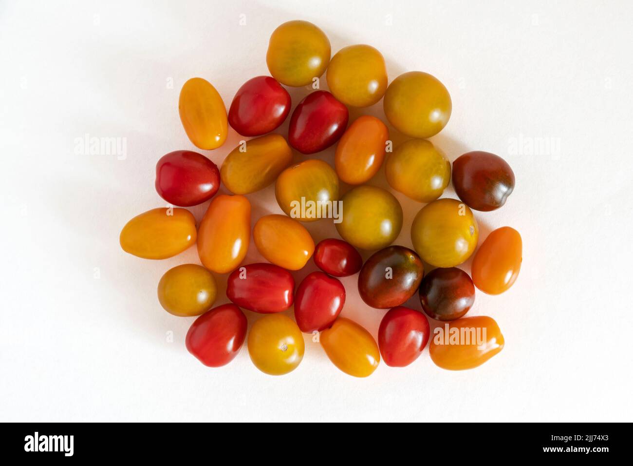 Close-up of a group of cherry tomatoes of different colours, yellow ...