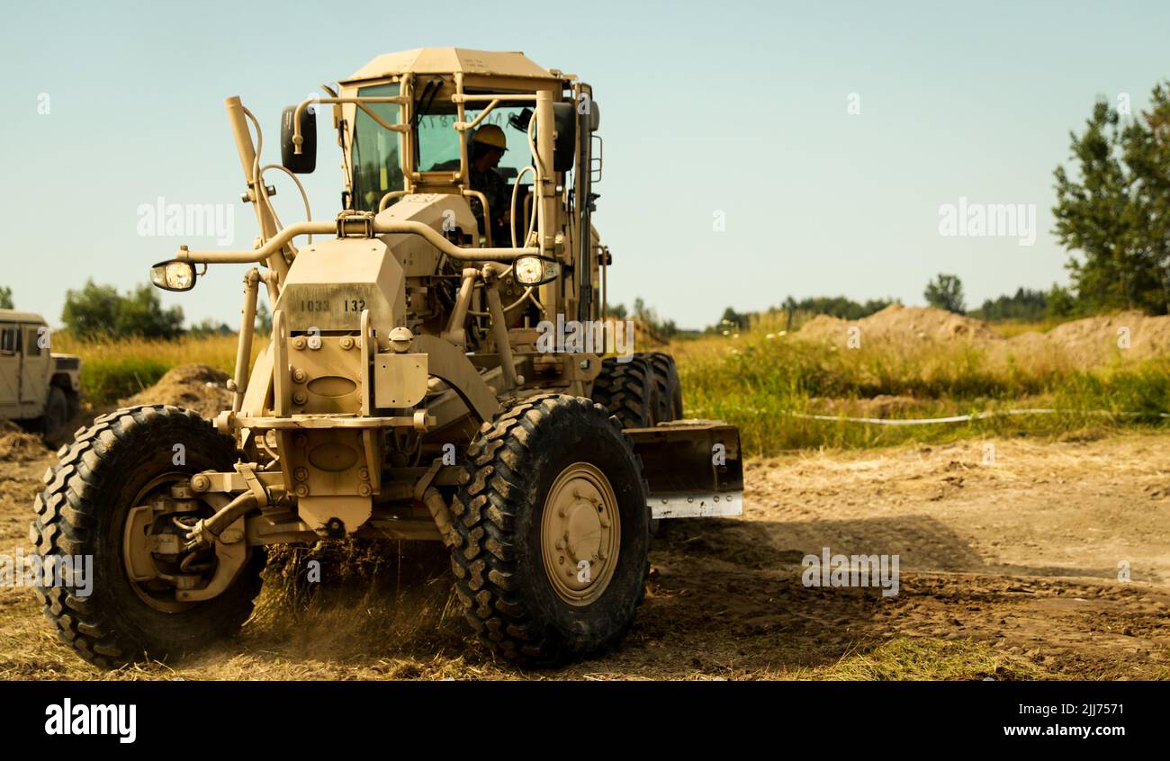 120 M Motor Grader Dozers assigned to the 1033rd Engineer Support ...
