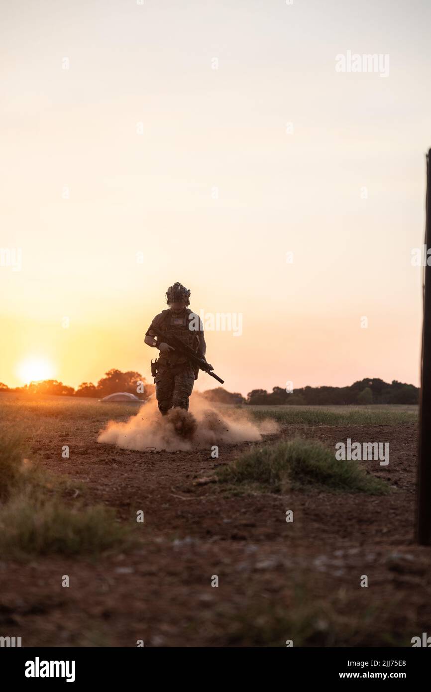 A critical skills operator patrols alongside explosive ordnance ...