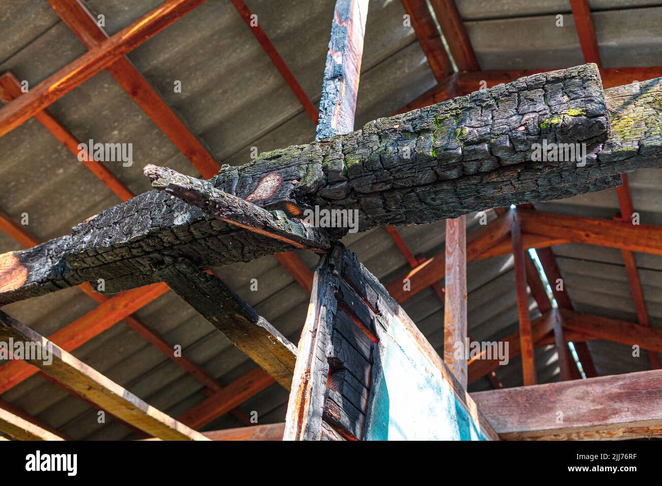 Burnt wooden beams of the house . Building after the fire Stock Photo ...