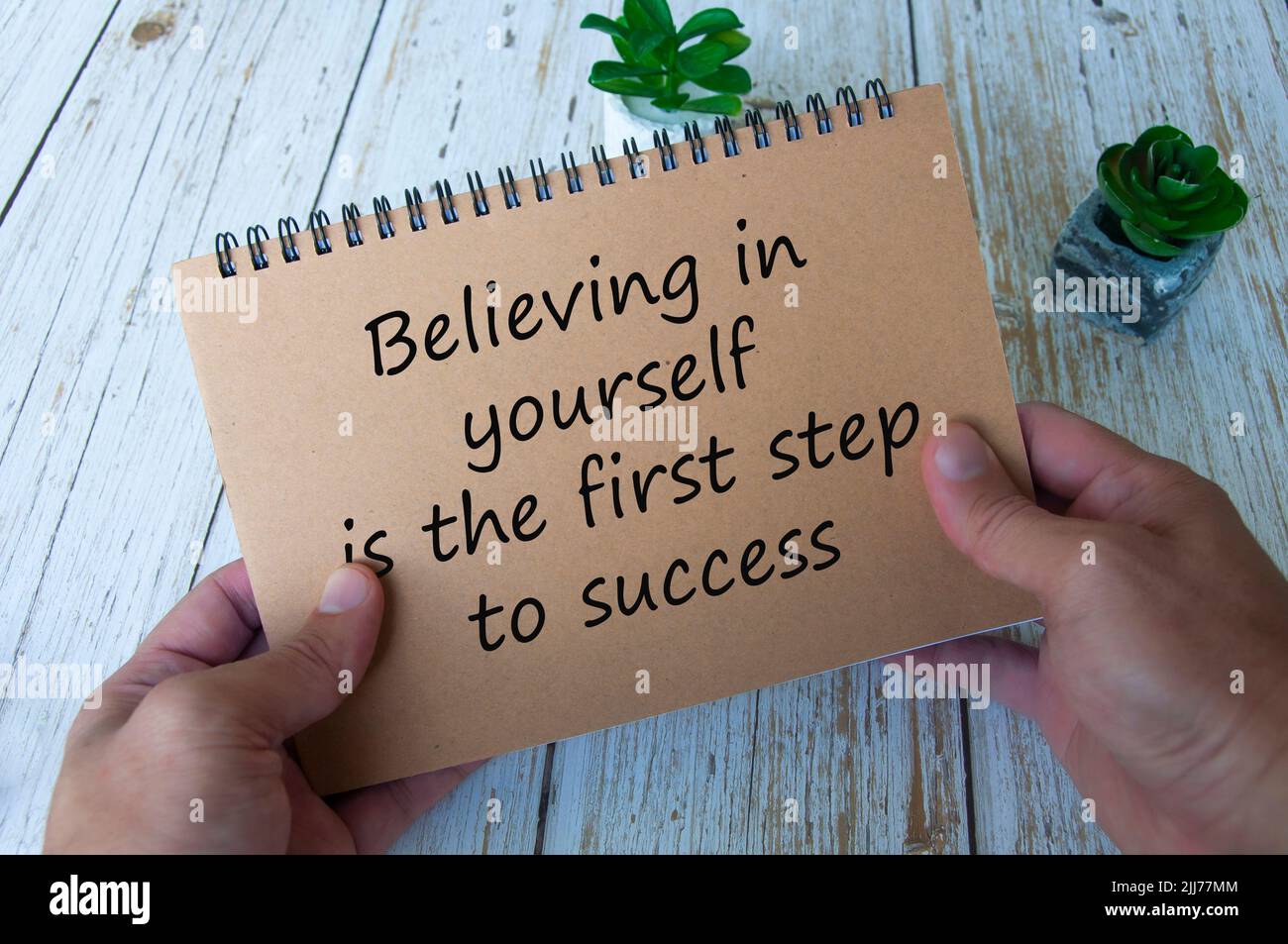 Life inspirational quote text on brown notepad - Believing in yourself ...