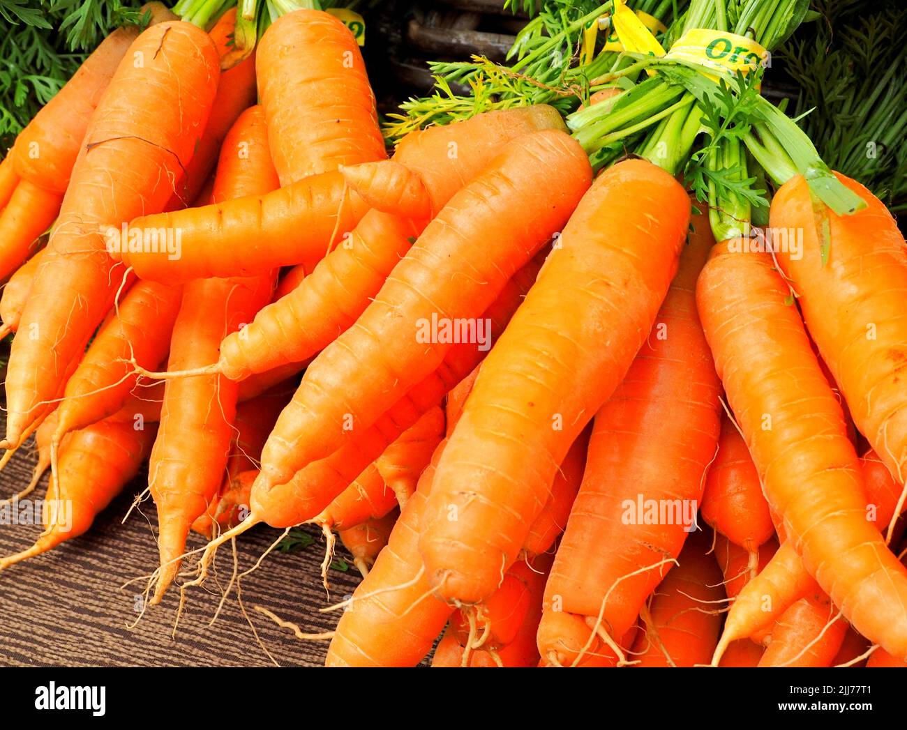 Fresh carrots greens close hi-res stock photography and images - Alamy