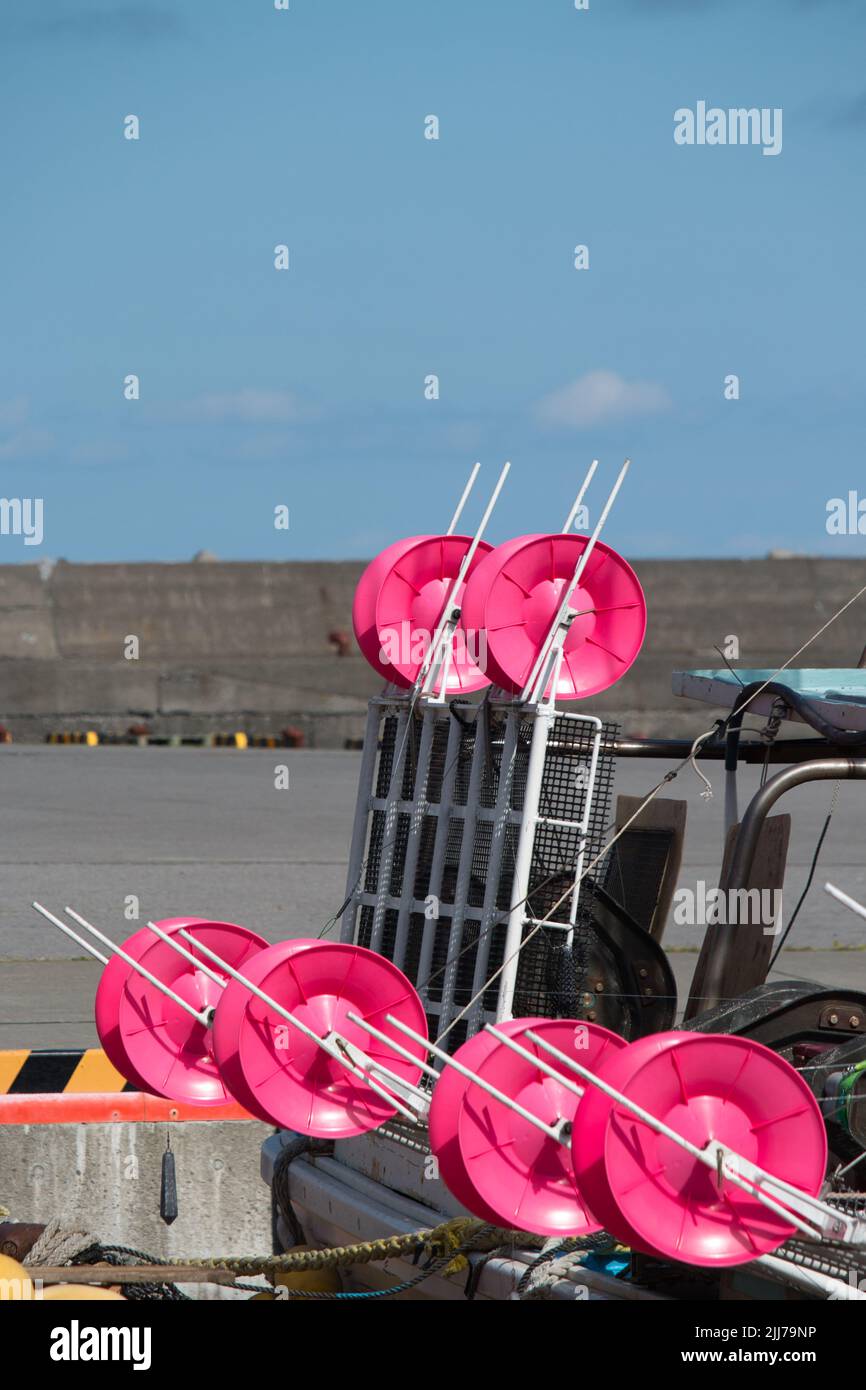 Pink rollers on automatic jigging machine Stock Photo - Alamy