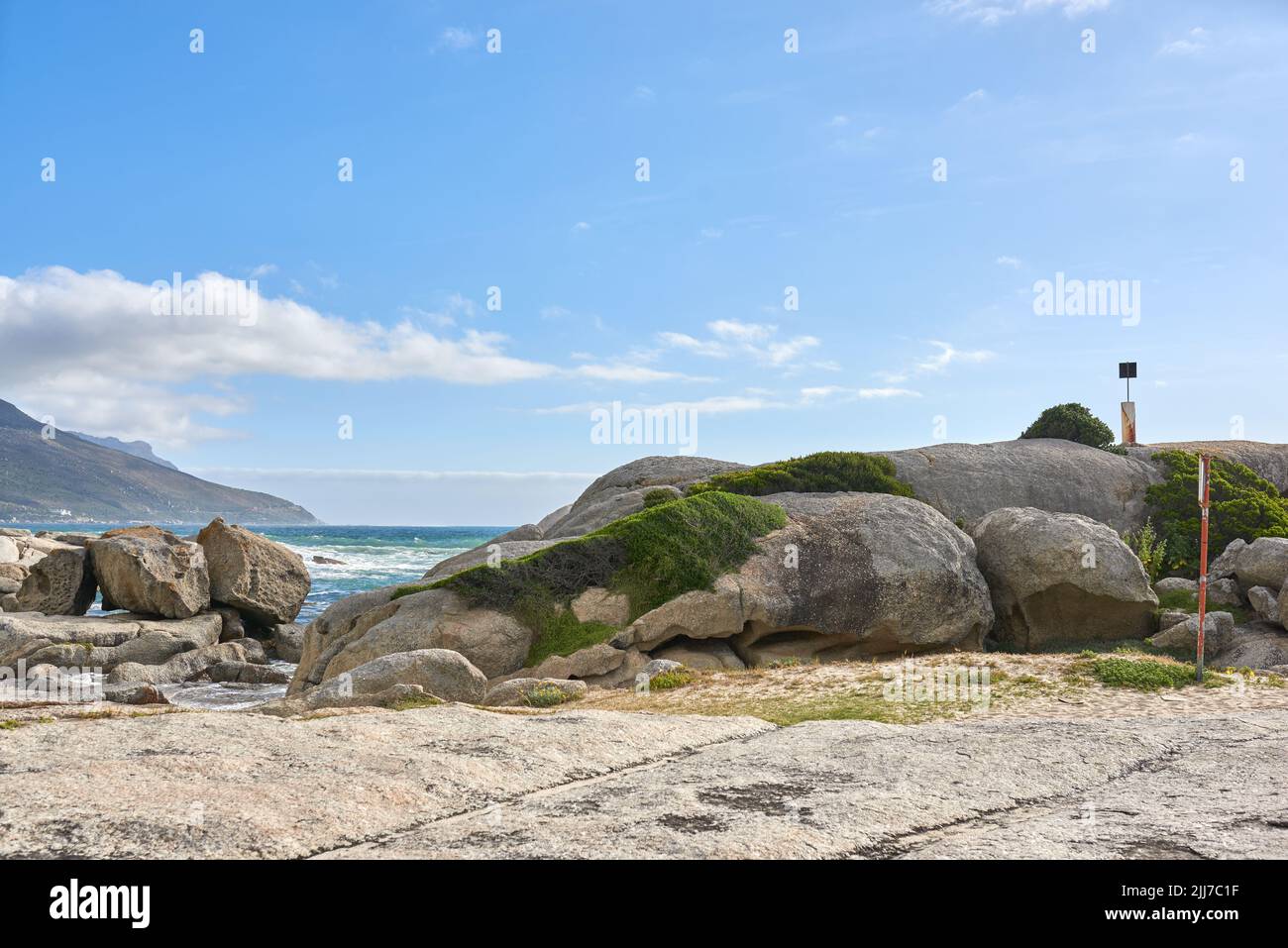Copy space, sea and ocean rocks on a remote, quiet and serene beach in ...
