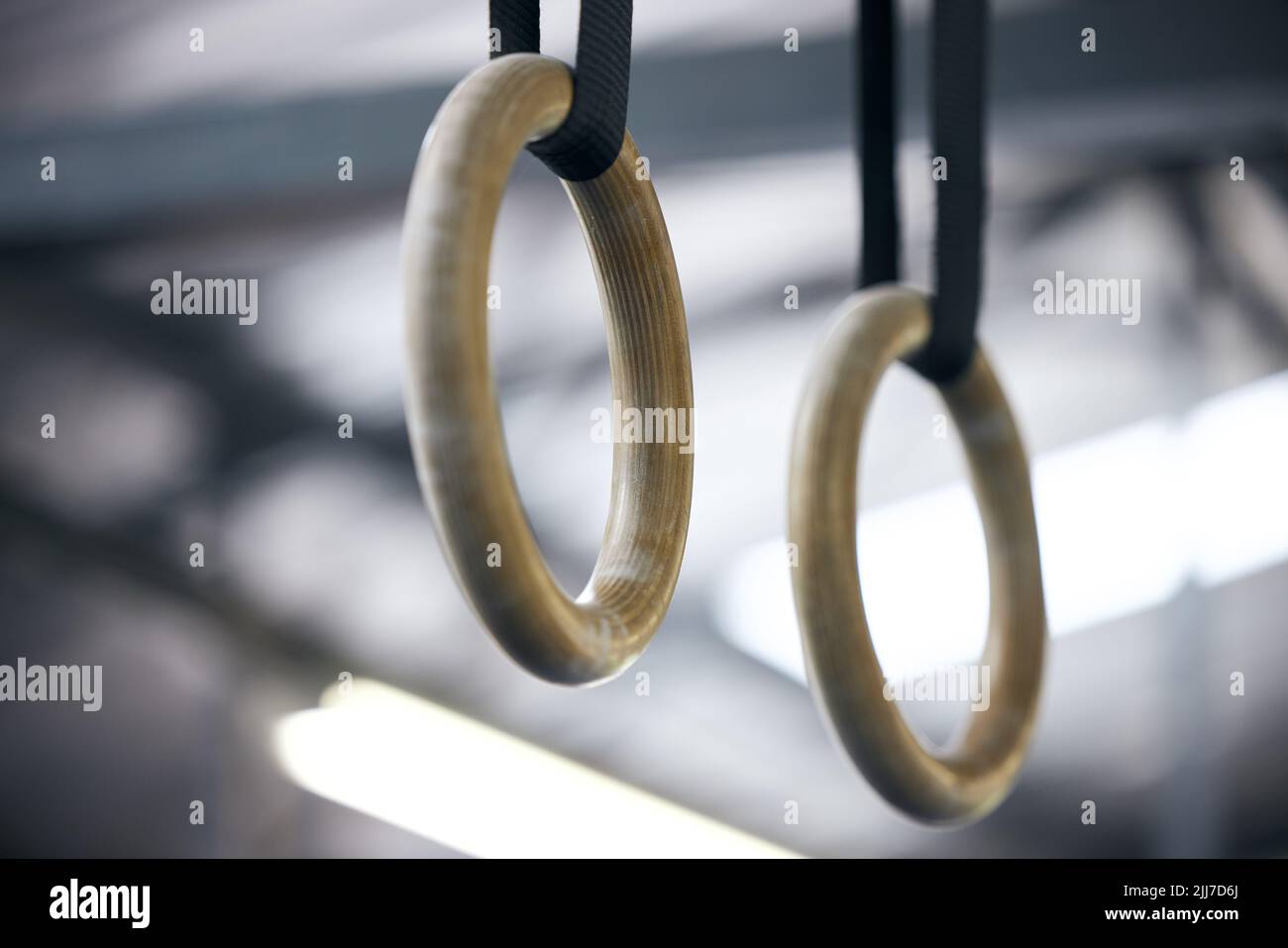 Grab hold and give it all youve got. a gymnastics ring hanging in an ...