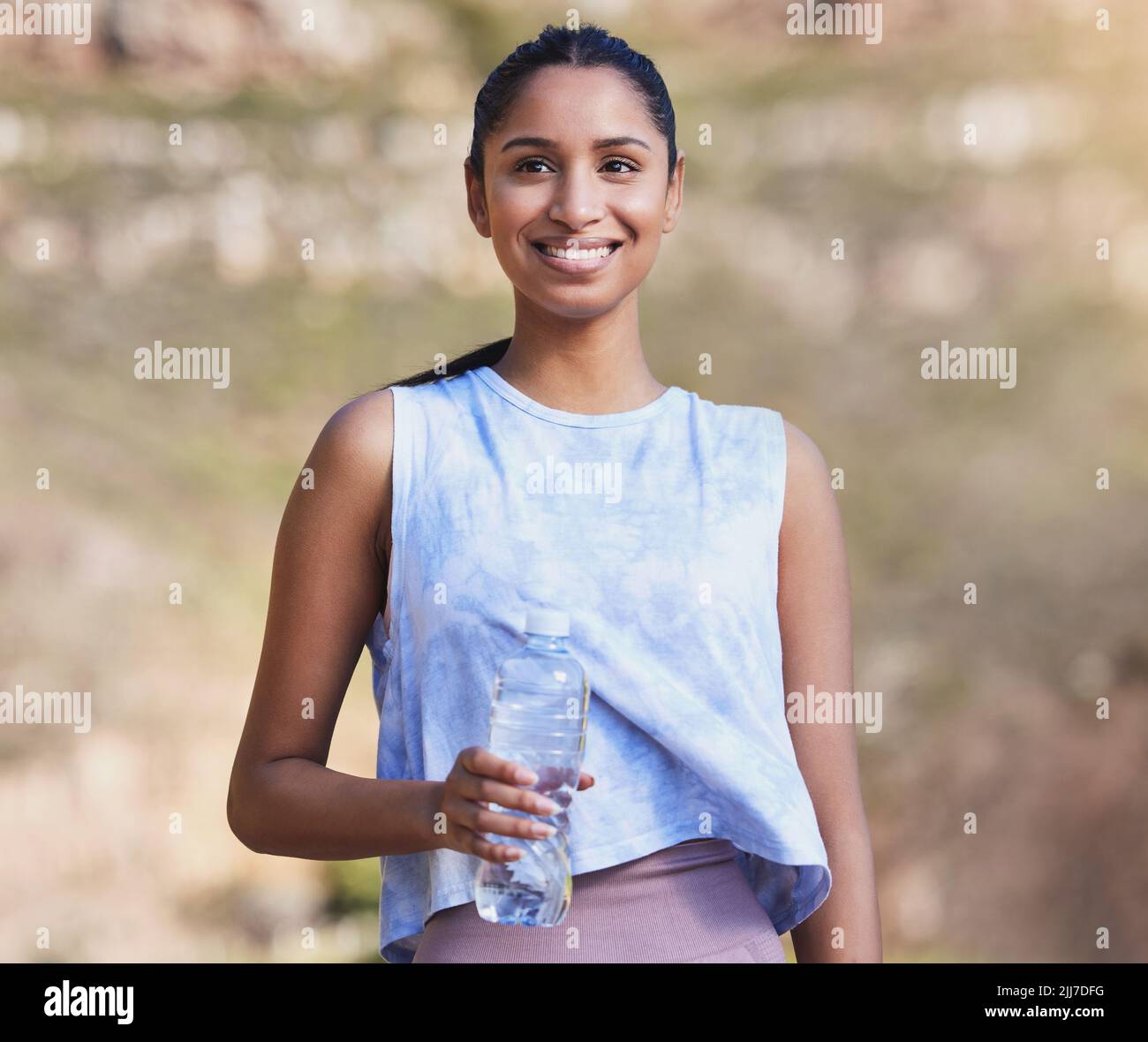 Thinking about the run. an attractive young female athlete taking a ...