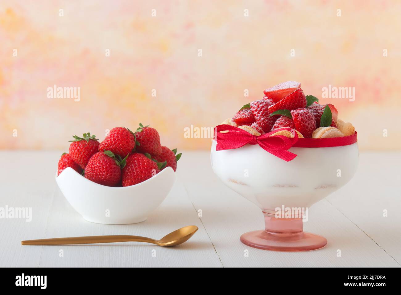 Charlotte, French dessert with strawberries tied up with a scarlet ...