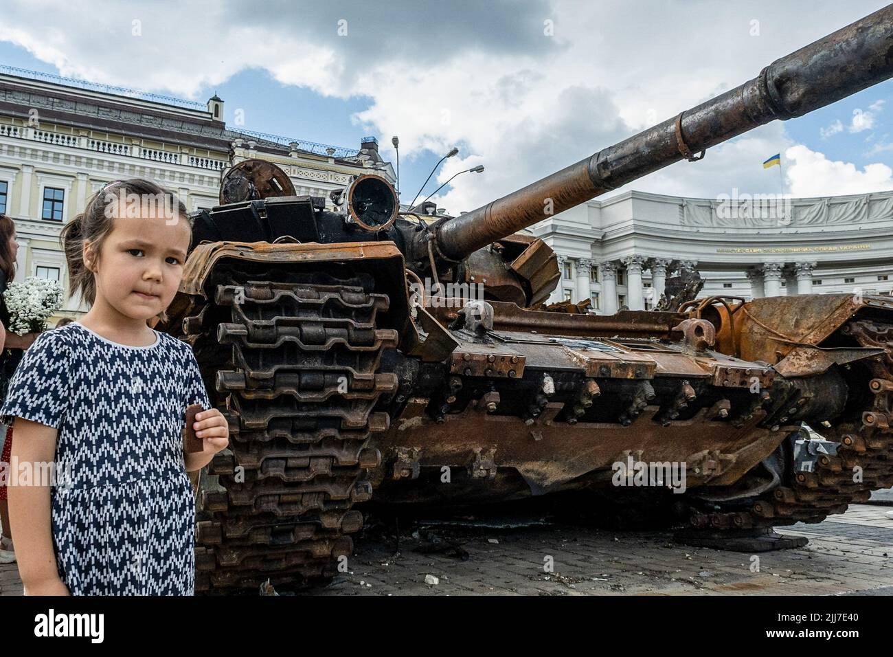 A child was seen eating a chocolate bar in front of a destroyed Russian ...