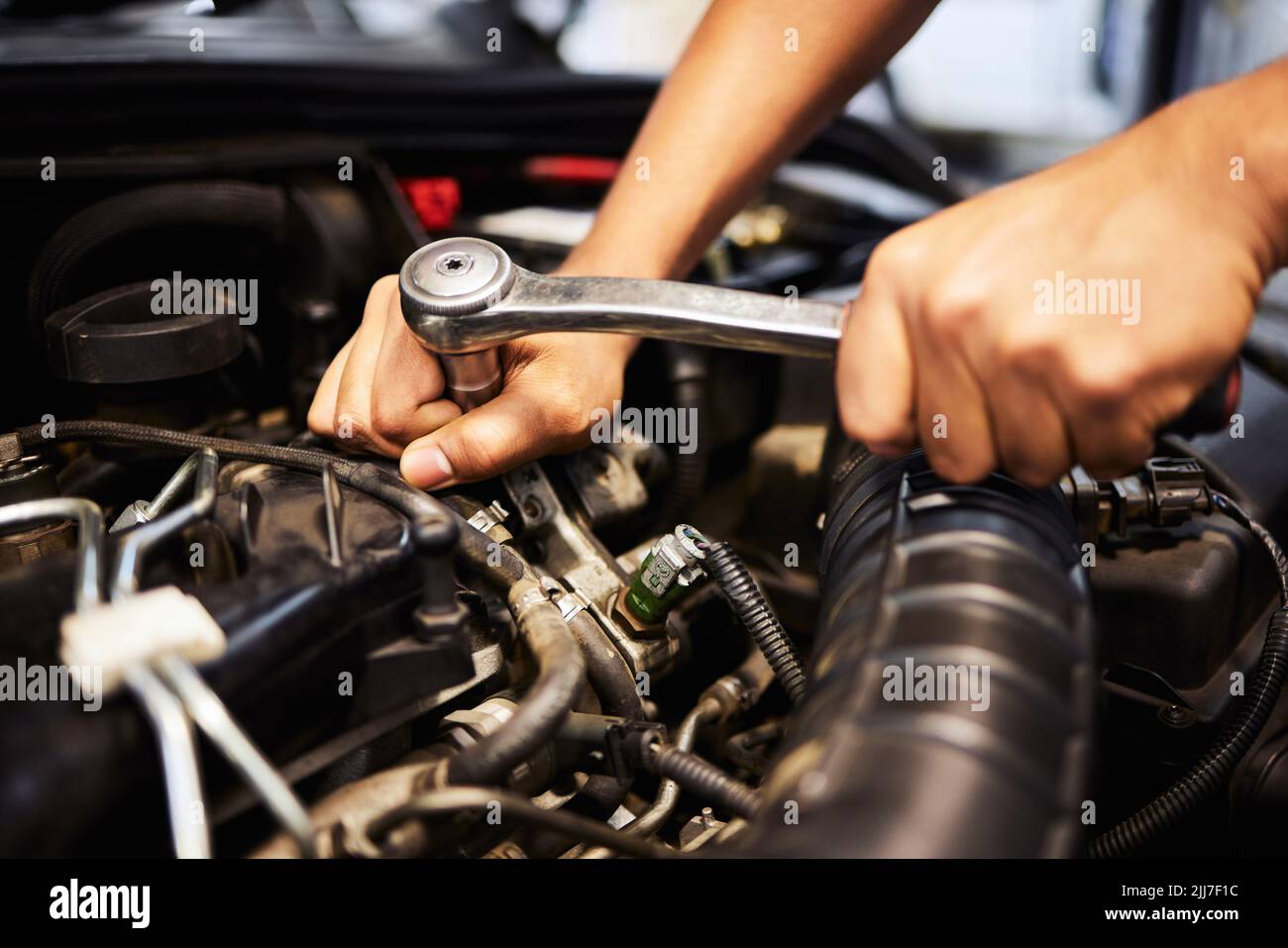 Whats that rattling noise. an unrecognizable male mechanic working on ...