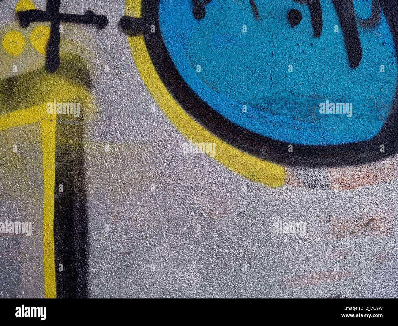 A graffiti on a wall in Kyiv, Ukraine in yellow, silver, and black ...
