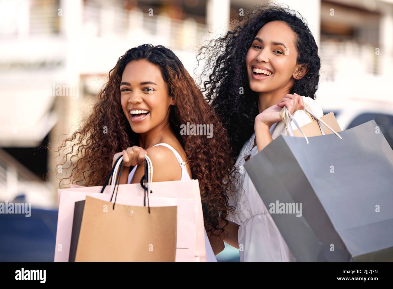 Making the most of our time together. two young friends going shopping ...