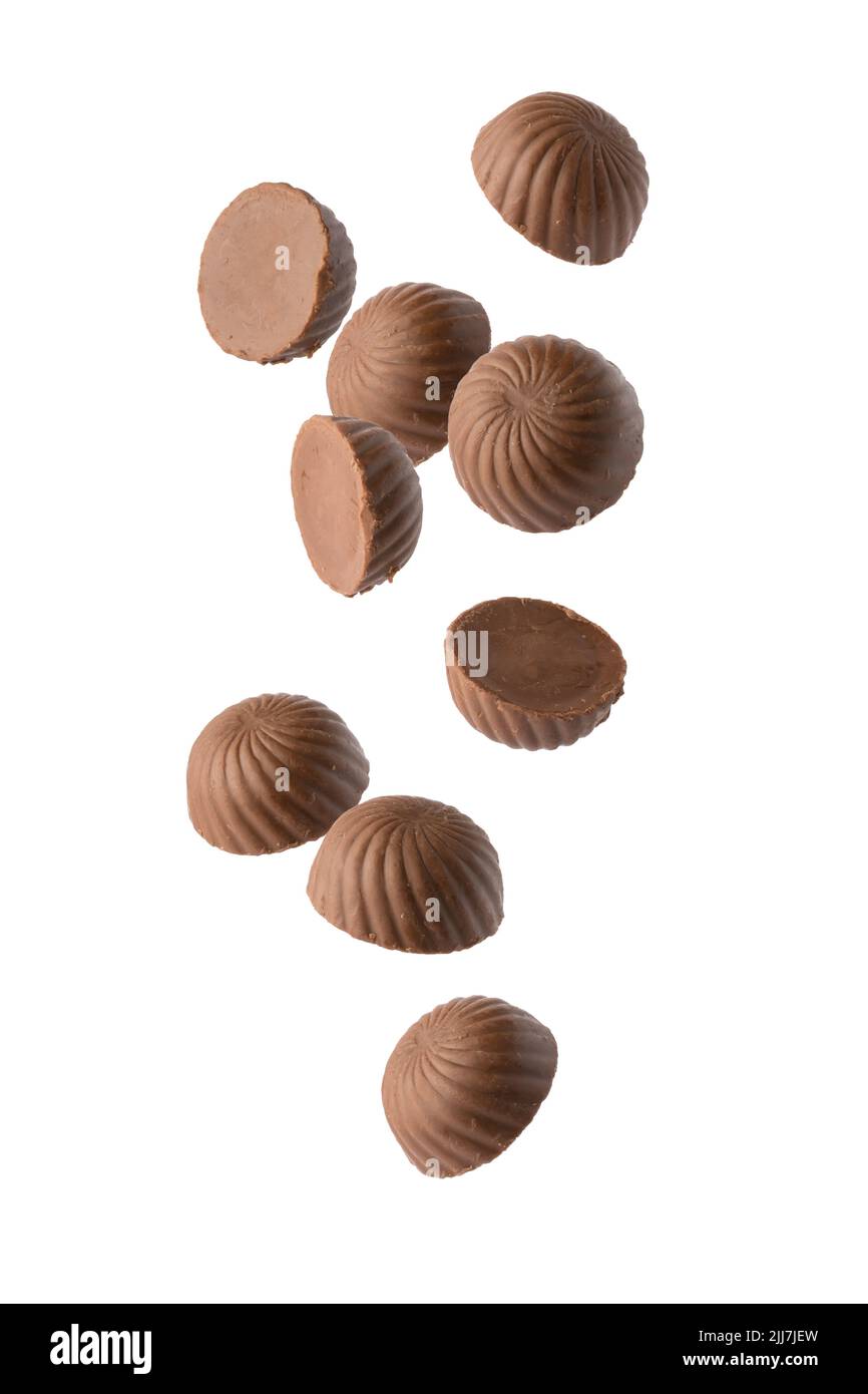 chocolate candy or sweets falling, isolated on white background ...