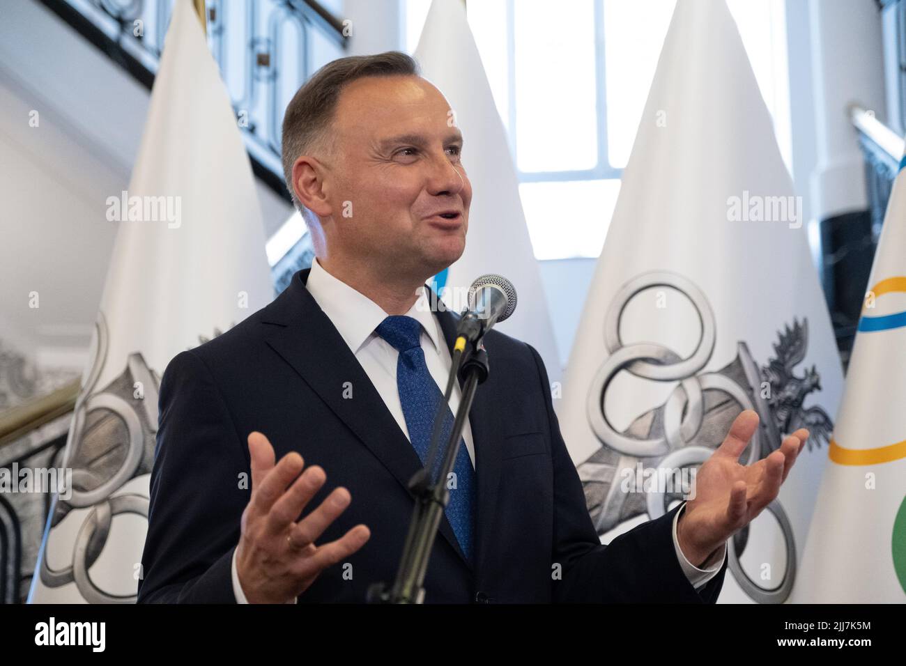 Polish President Andrzej Duda, seen speaking in front of flags with ...