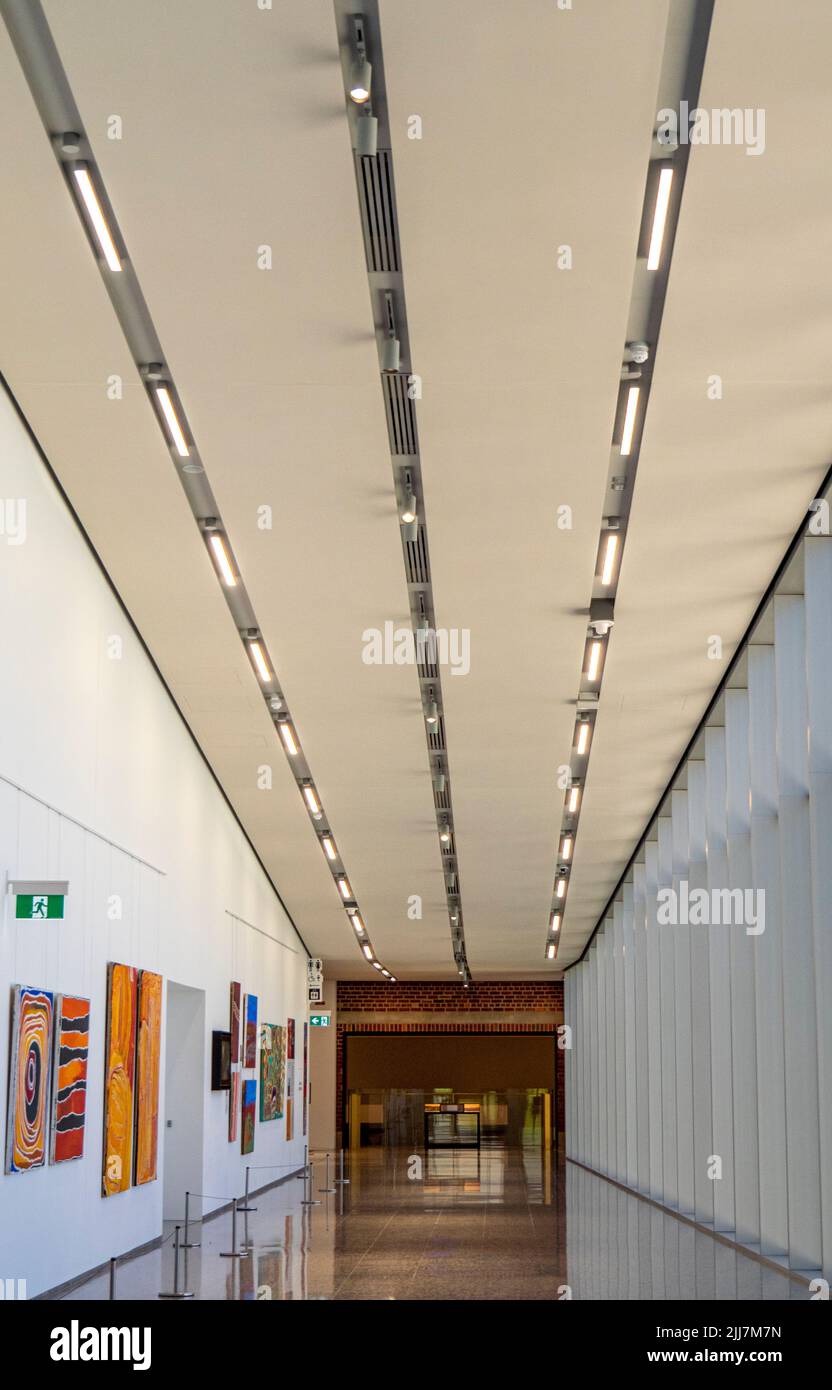 Indigenous artwork hanging on wall of long corridor in Boola Bardip WA ...