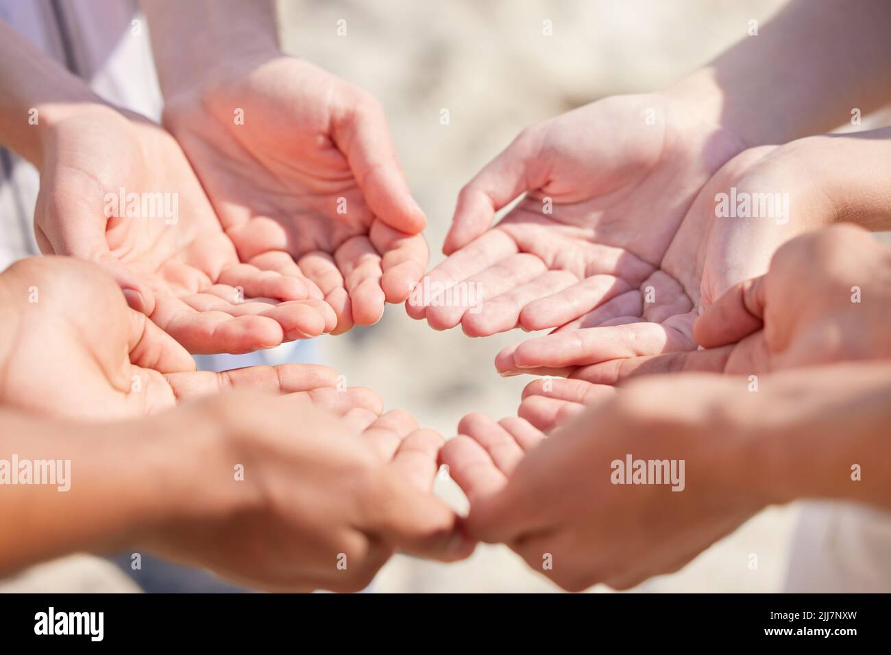 Always give back to those less fortunate. a group of unrecognisable ...