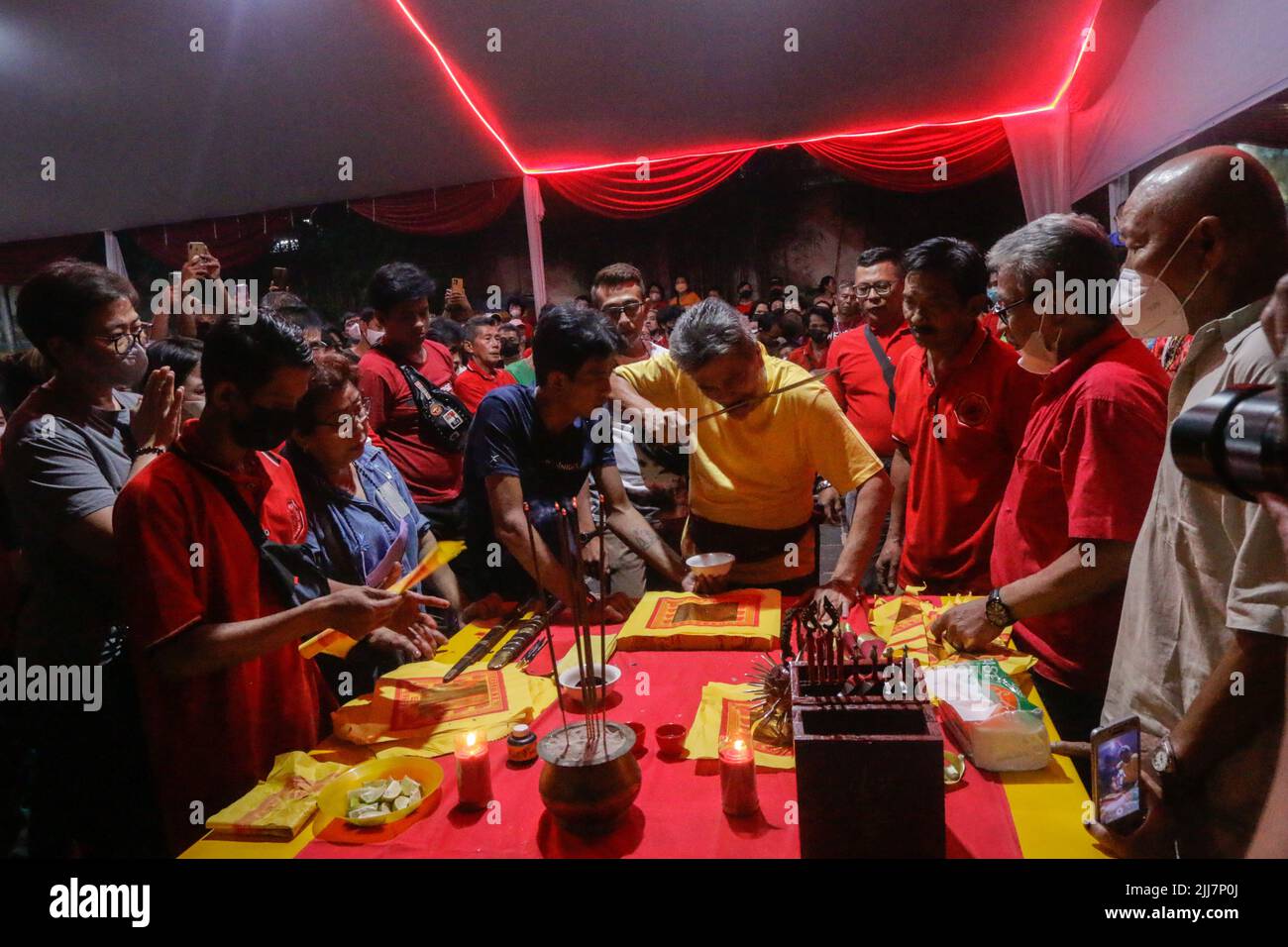 Bogor, Indonesia. 22nd July, 2022. A Indonesian Chinese devotee cutting ...