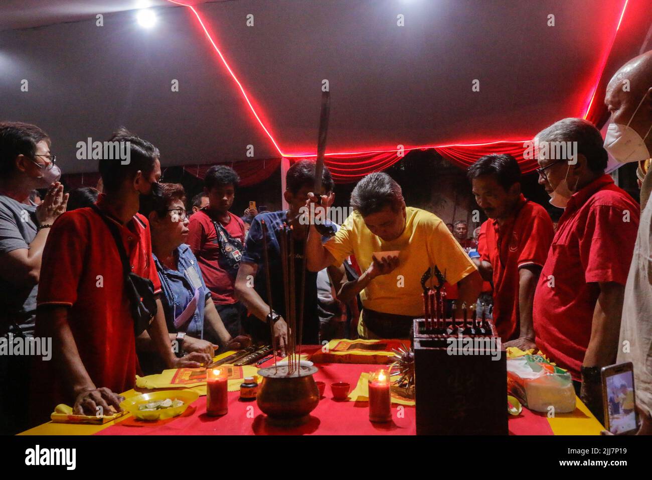 Bogor, Indonesia. 22nd July, 2022. A Indonesian Chinese devotee cutting ...