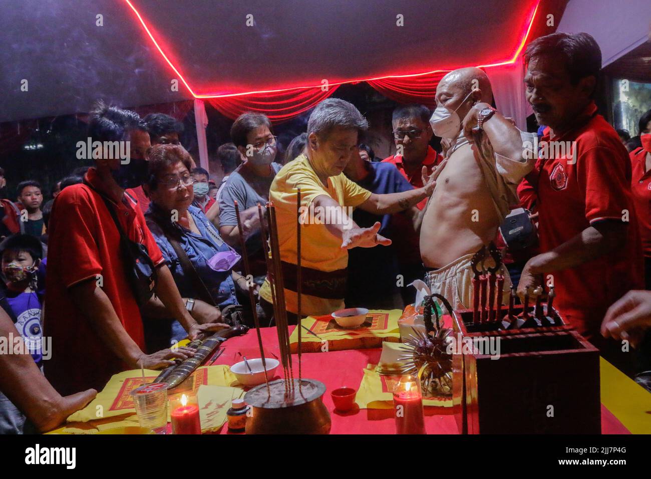 A Indonesian Chinese devotee take part in a ritual at Dhanagun temple ...