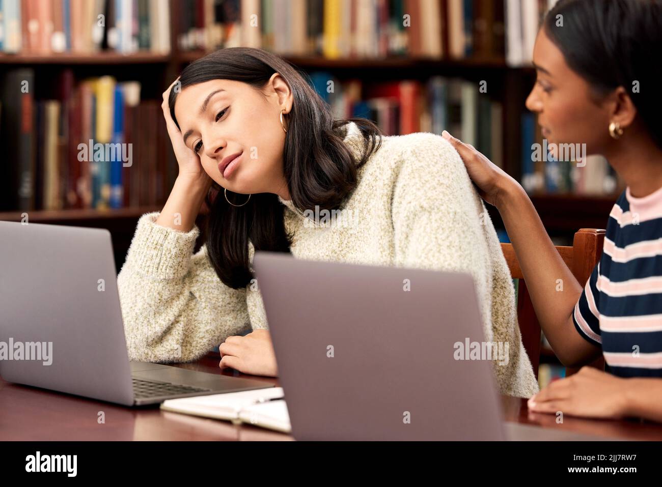 Friends are always there to comfort you when youre down. a young female ...