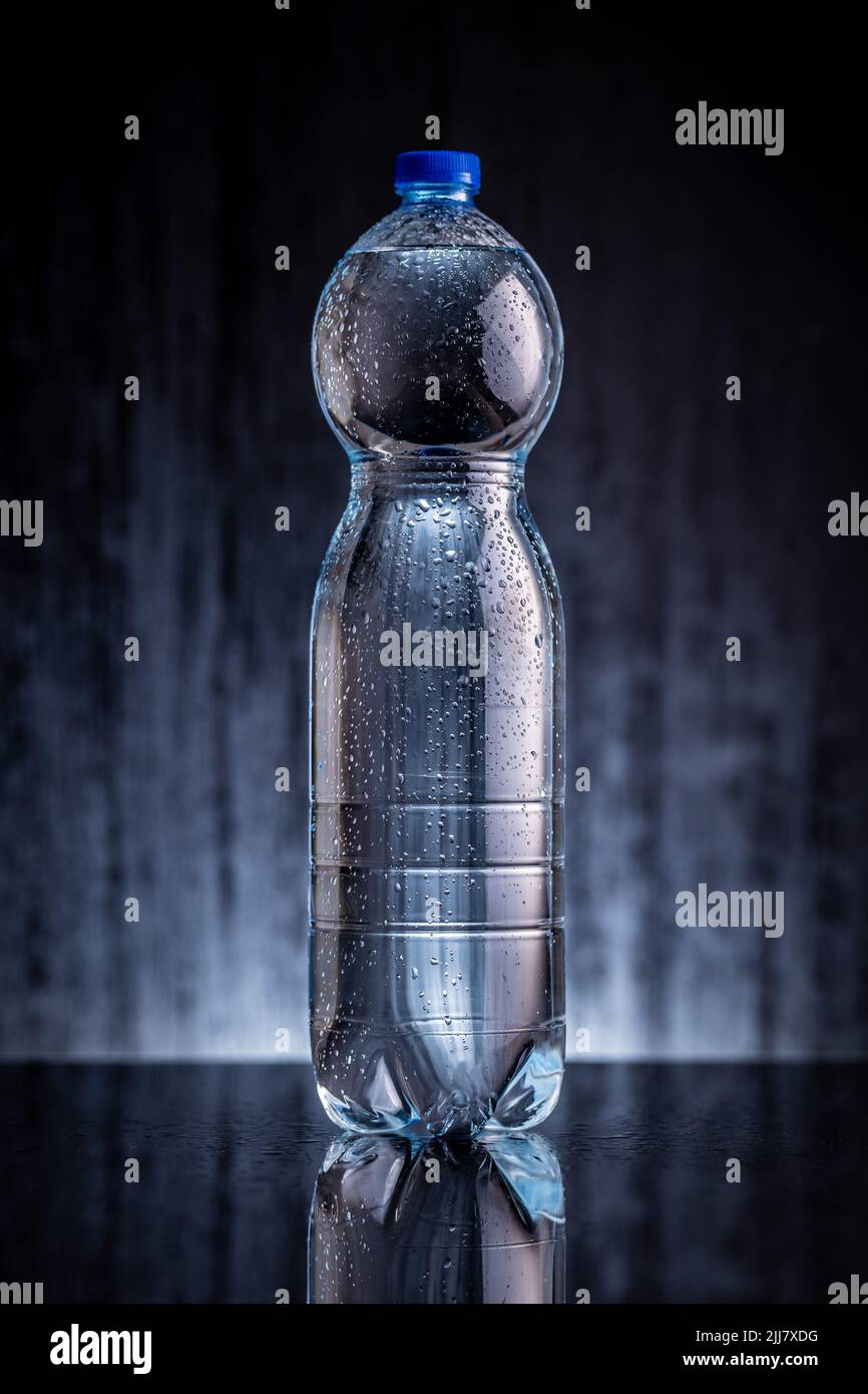 Plastic cold bottle of water with the water drops Stock Photo - Alamy