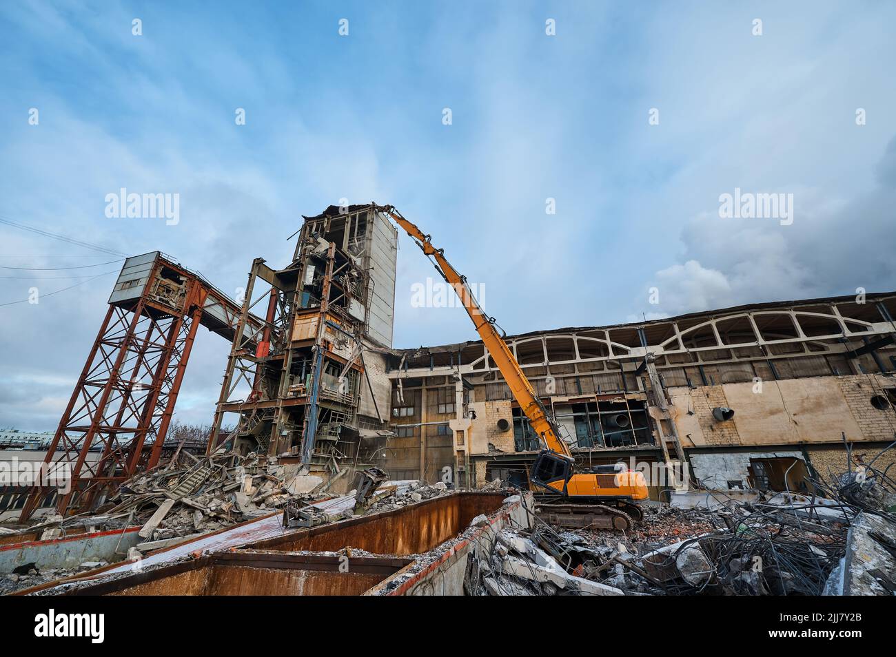 Destroying of old industrial building by excavator destroyer Stock ...