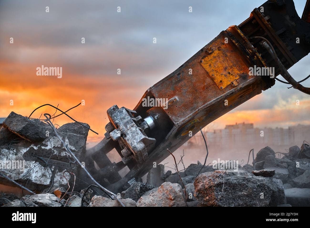 Metal crusher on excavator rigging destroys armored concrete Stock ...