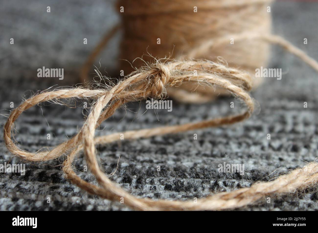 Skein of jute twine. Natural jute twine, macro shot. Rough jute thread ...