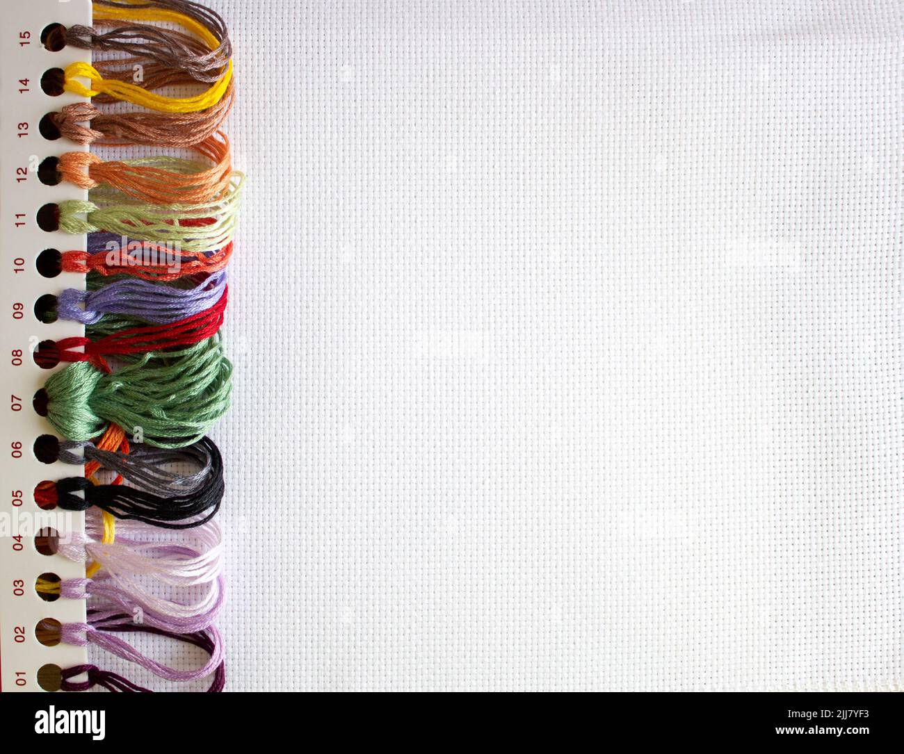 Set of colorful threads for embroidery to start cross stitching with ...