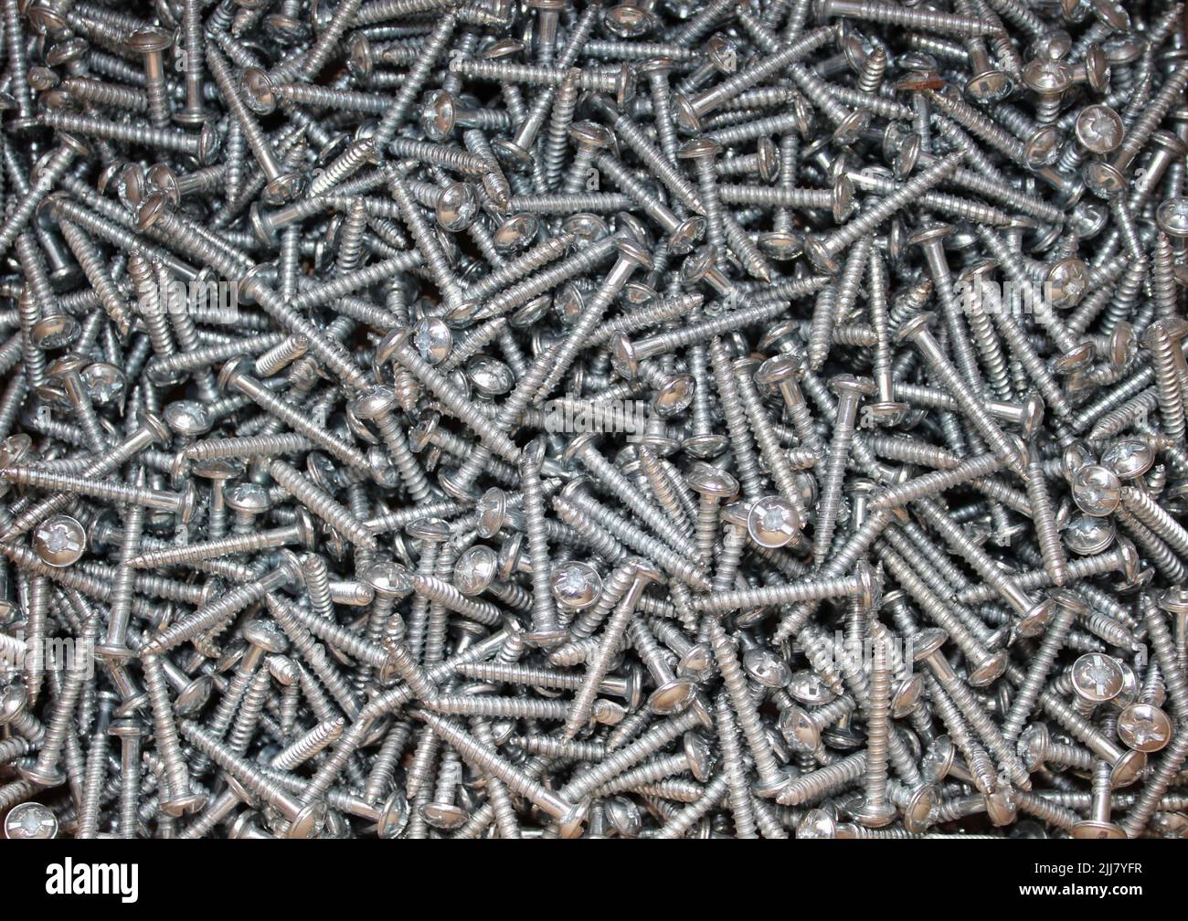 Macro photo of set of screws. Construction abstraction. Industrial ...