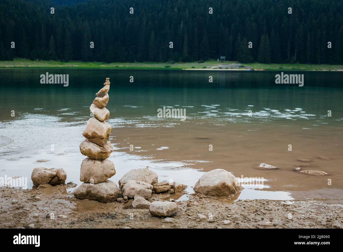 Pyramid of stones is composed on the shores of Black Lake in Montenegro ...