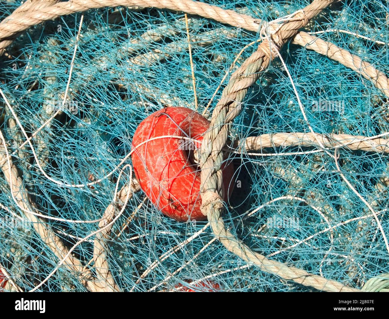 Blue fisher net to catch fish Stock Photo - Alamy