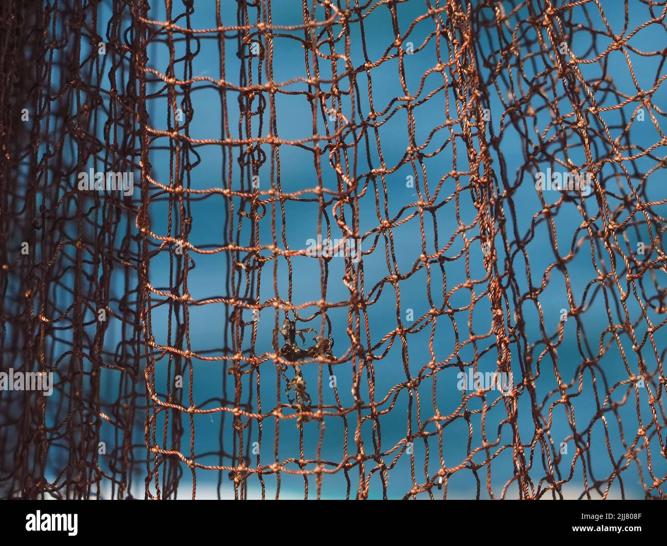 Brown fisher net to catch fish Stock Photo - Alamy