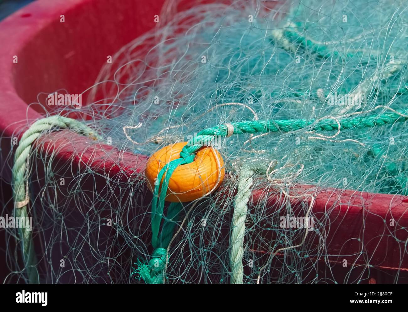 Blue fisher net to catch fish Stock Photo - Alamy