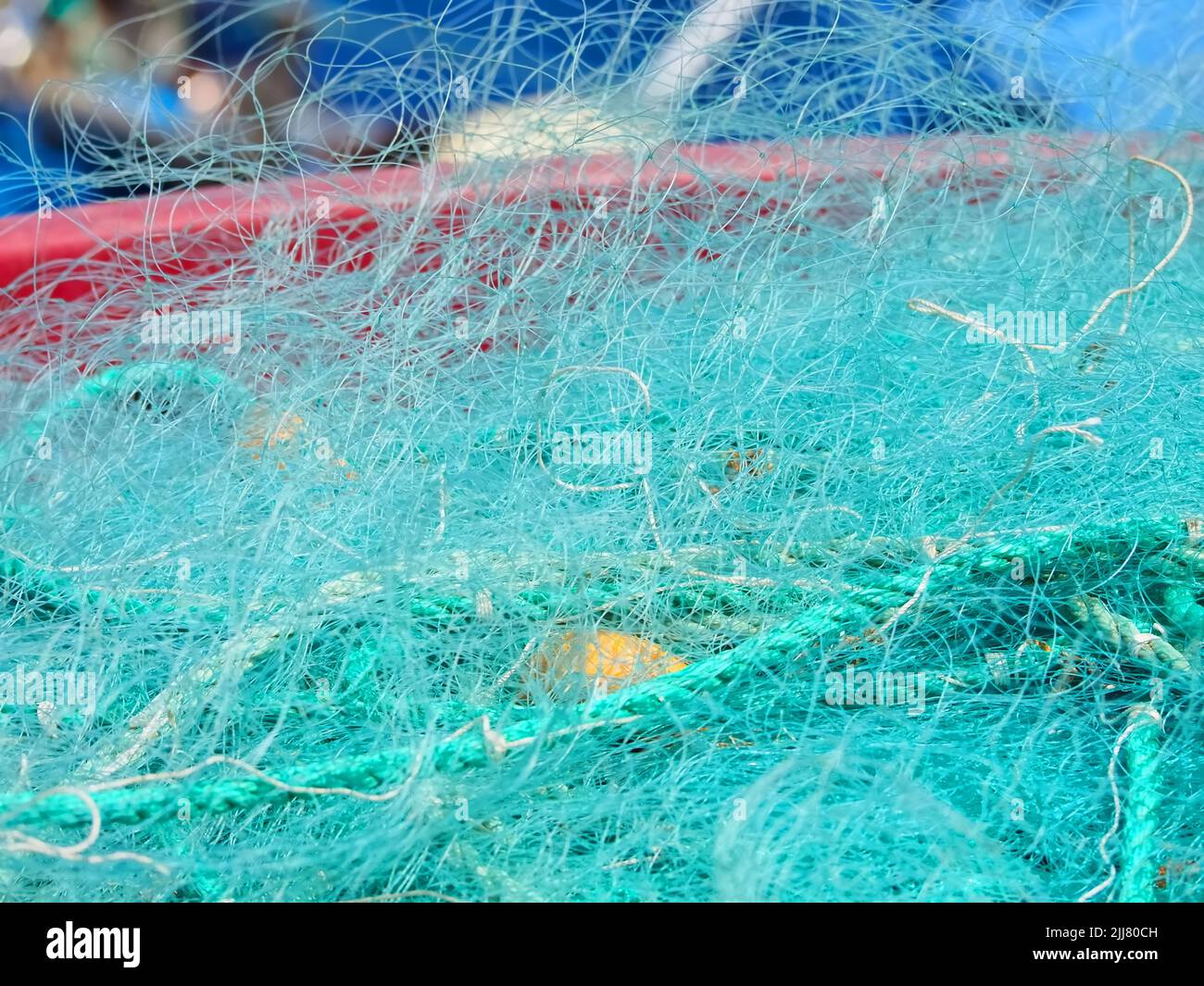 Blue fisher net to catch fish Stock Photo - Alamy
