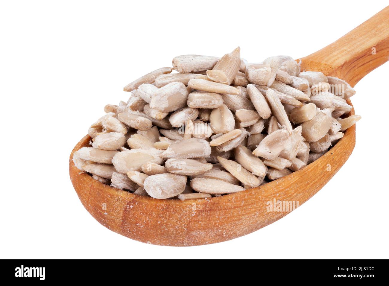 Shelled sunflower seeds in a wooden spoon isolated on white background. File contains clipping ...